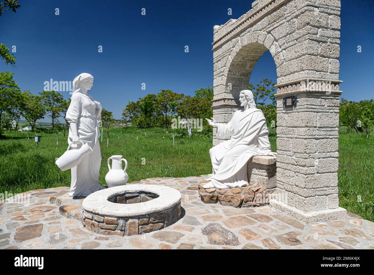 White stone statues in a theme park illustrate a scene from the Bible ...
