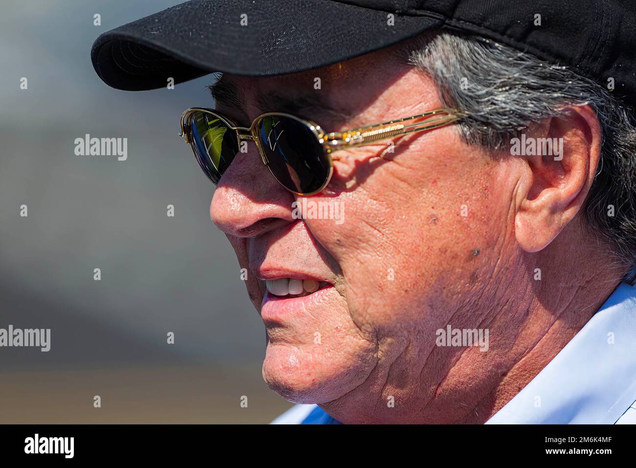 DAYTONA BEACH, FL - FEB 13, 2011: Felix Sabates watches his cars ...