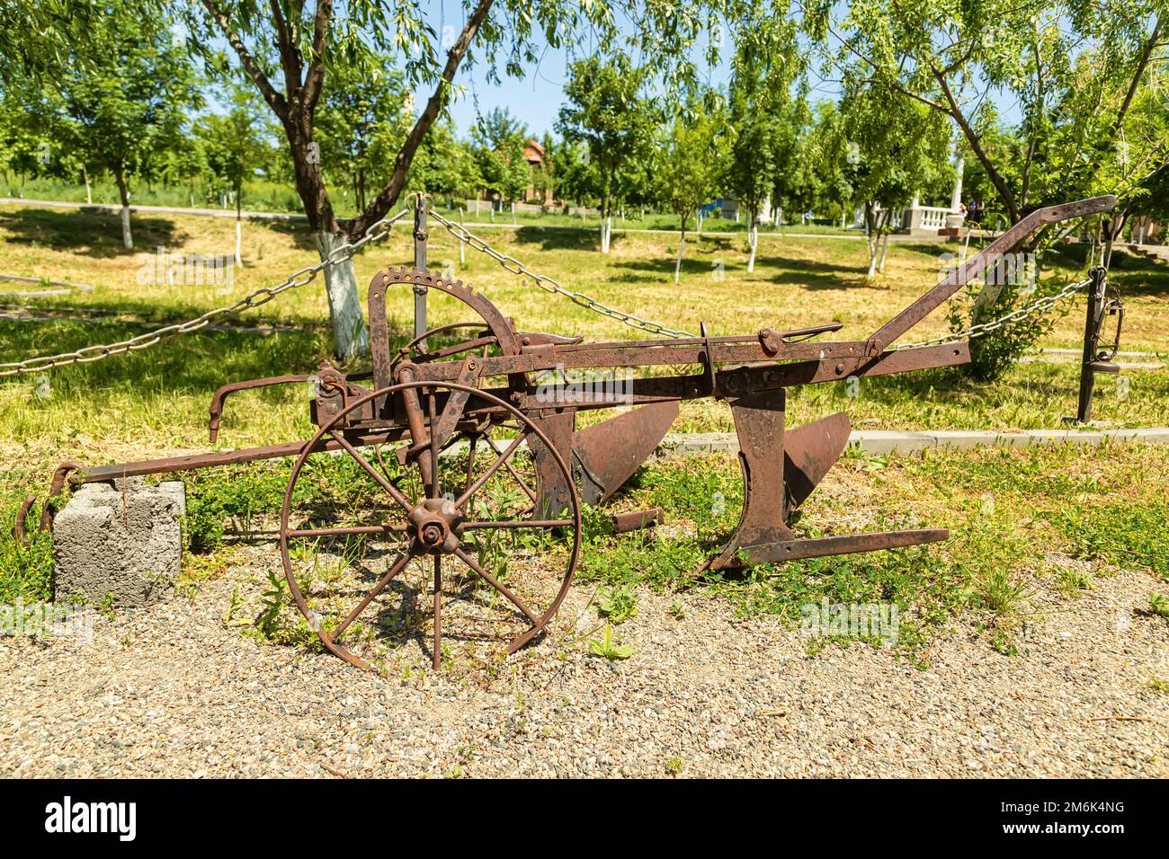 Antique metal mechanical device on wheels for agriculture Stock Photo ...