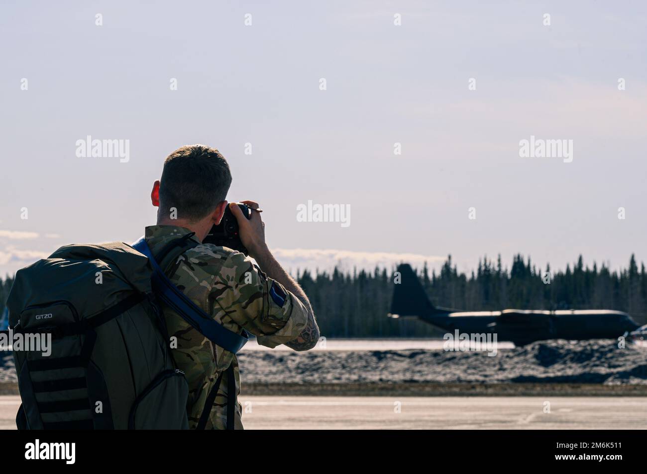 Senior Aircraftman Thomas Cann, Royal Air Force photographer, takes a ...