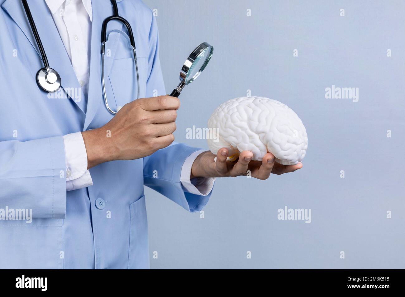 brain health and dementia series examine the brain with a magnifying ...