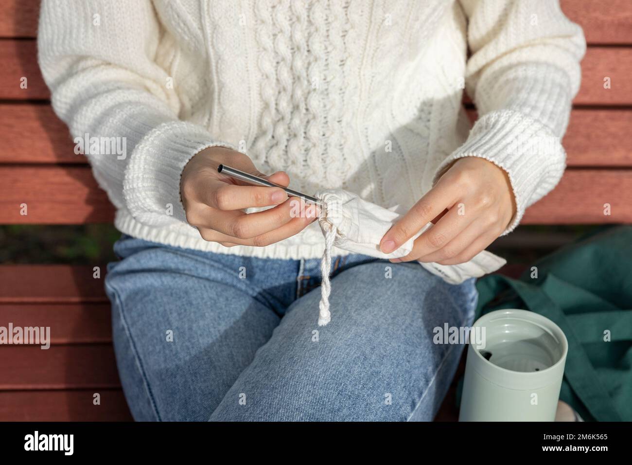 eco friendly habits hand gesture taking out a stainless steel straw ...