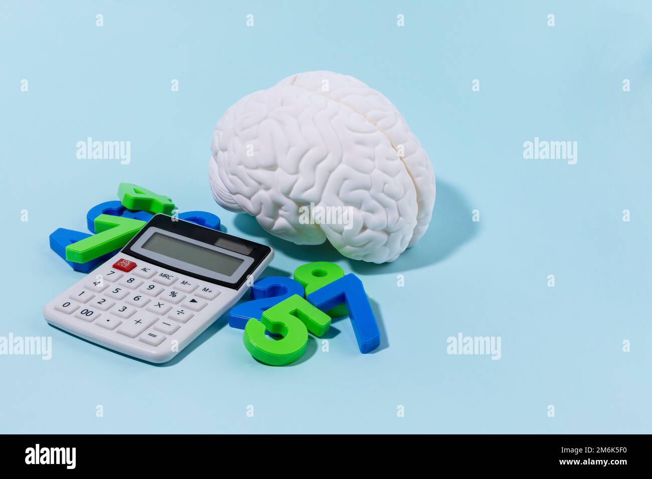 brain health and dementia series brain miniature, calculator, numbers ...