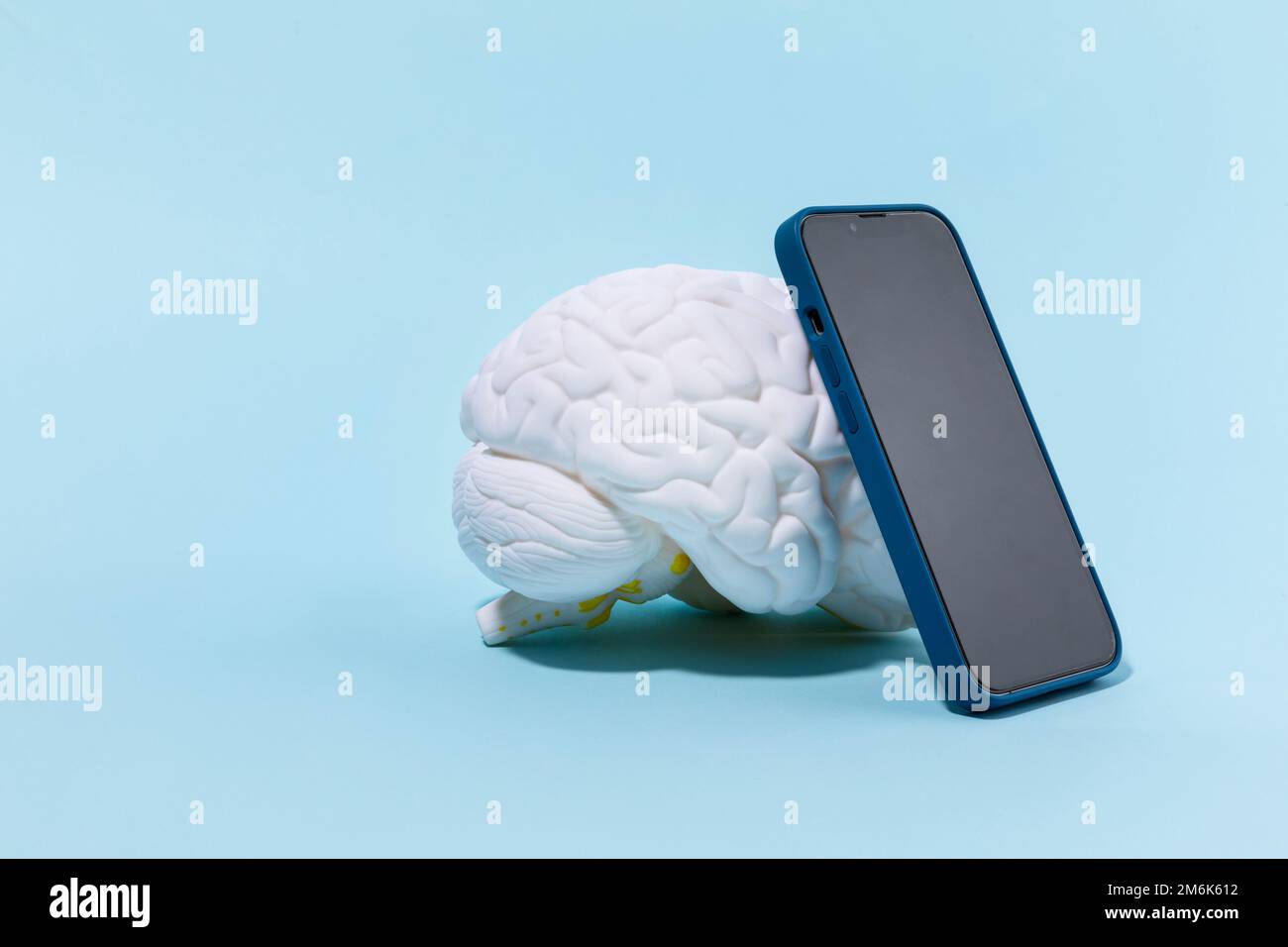 brain health and dementia series a brain miniature and cell phone Stock ...