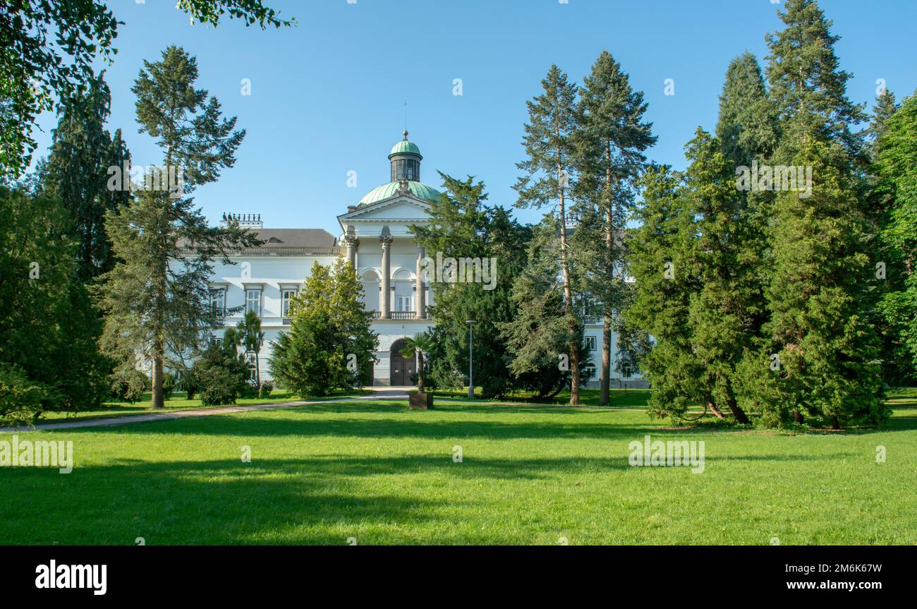 Classicist-style manor house and castle in Topolcianky park. Slovakia ...