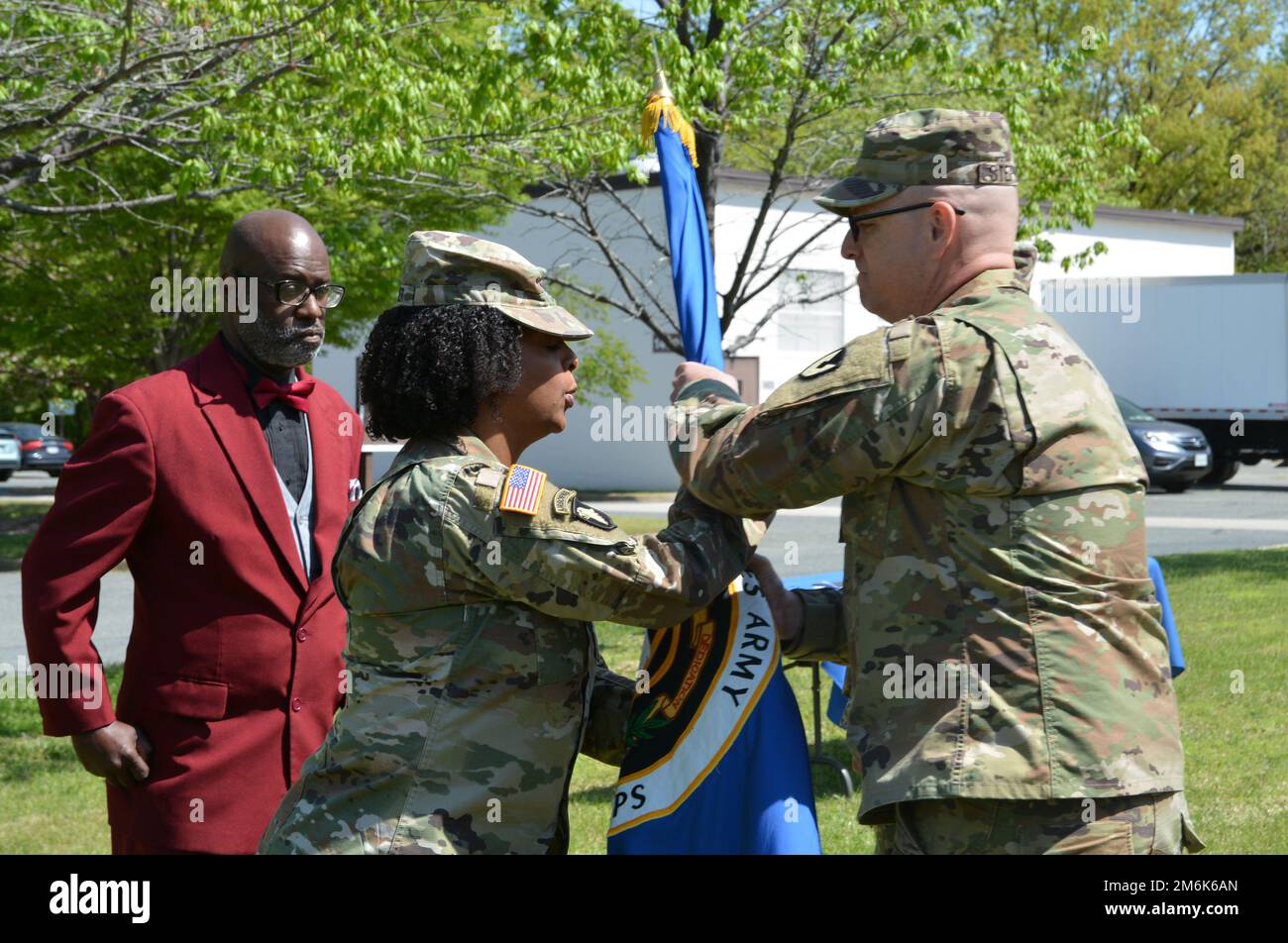 Lt. Col. Haneda Garner passes the organizational colors to Col. Toney ...