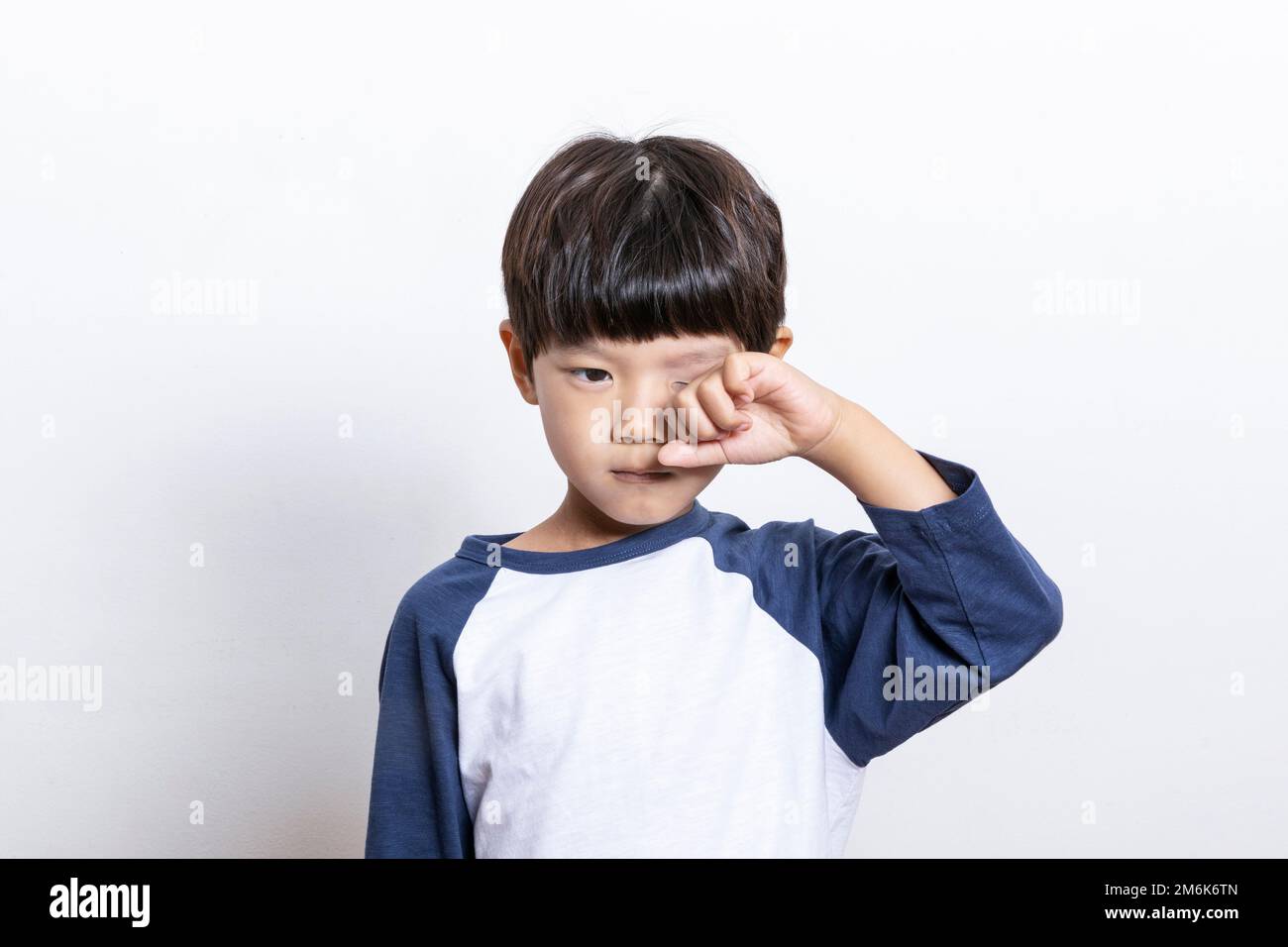 Child rubbing his eyes hi-res stock photography and images - Alamy