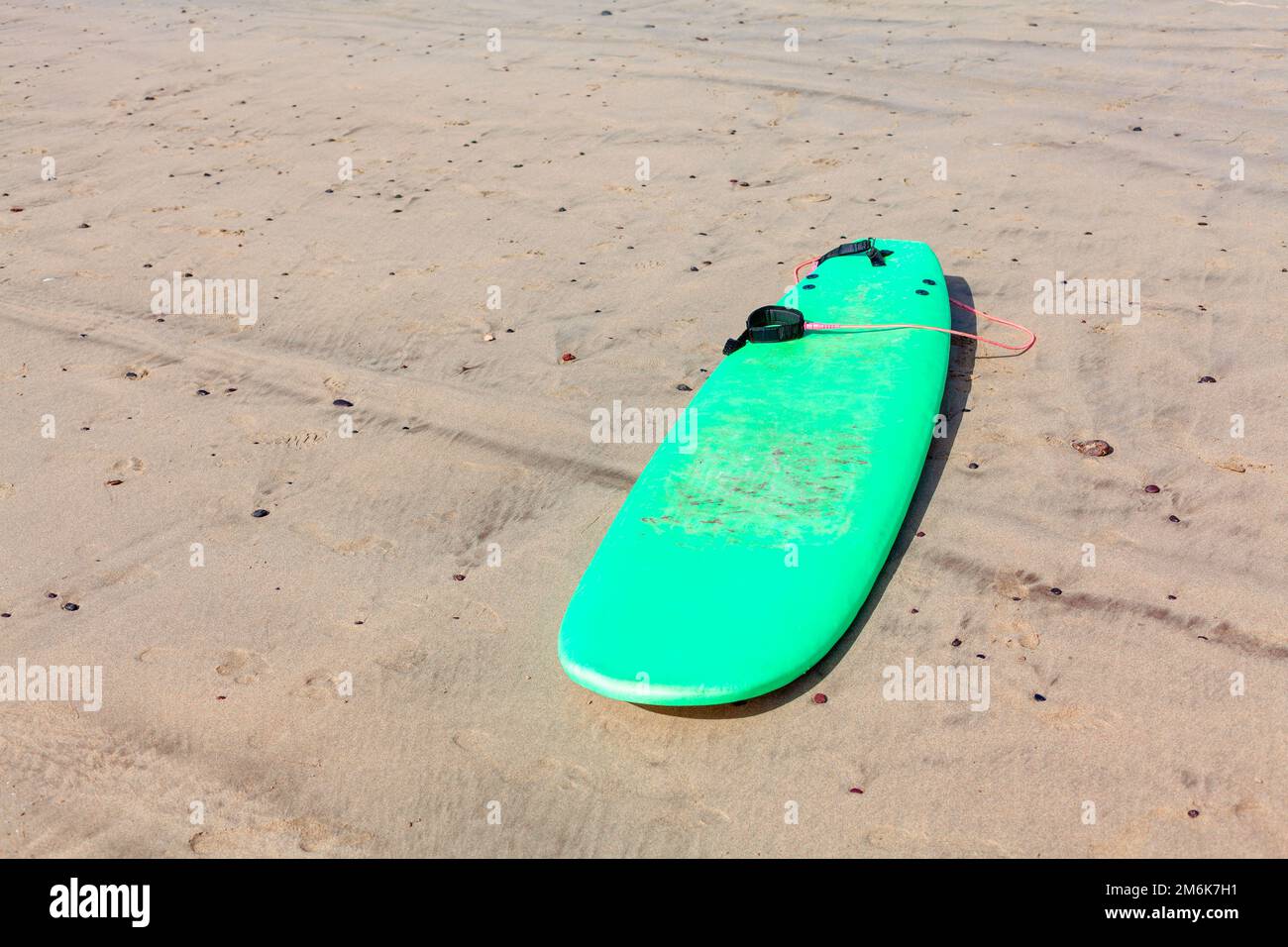 Surfboard on the sandy beach . Green surfboard at ocean coast Stock ...