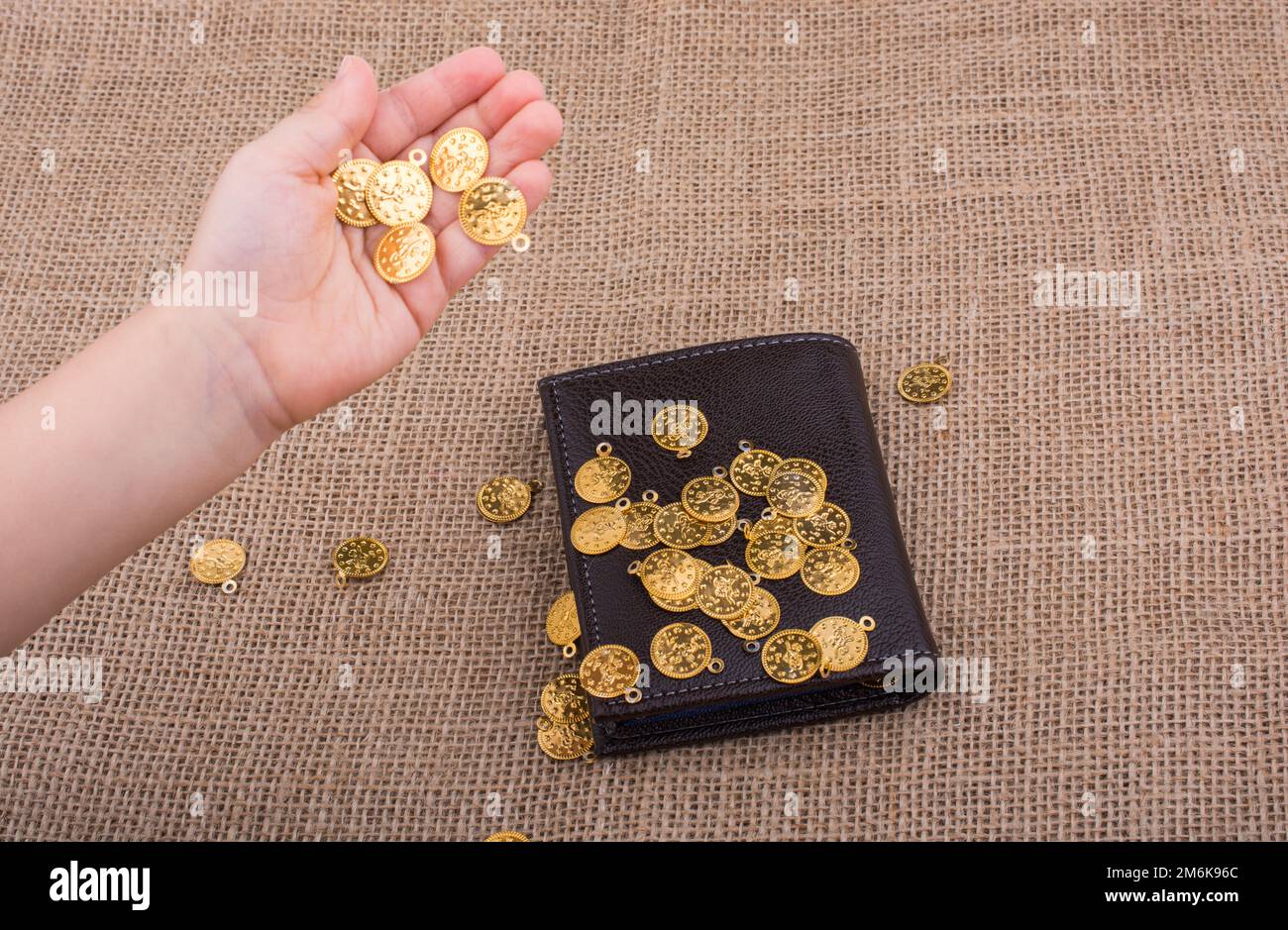 Gold wallet hi-res stock photography and images - Alamy