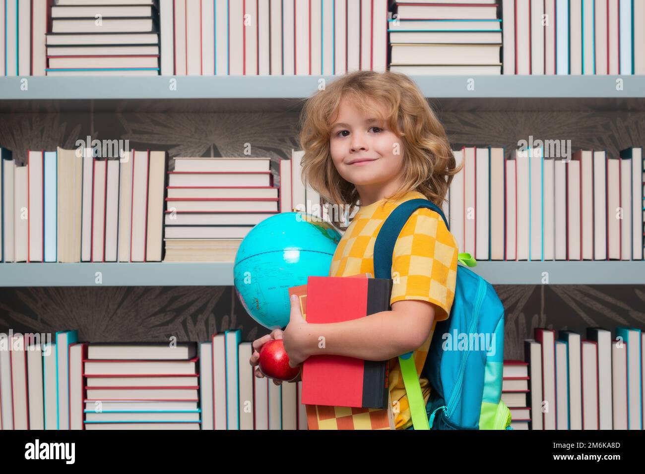 School boy with world globe and books. Nerd pupil. Clever child from elementary school with book ...