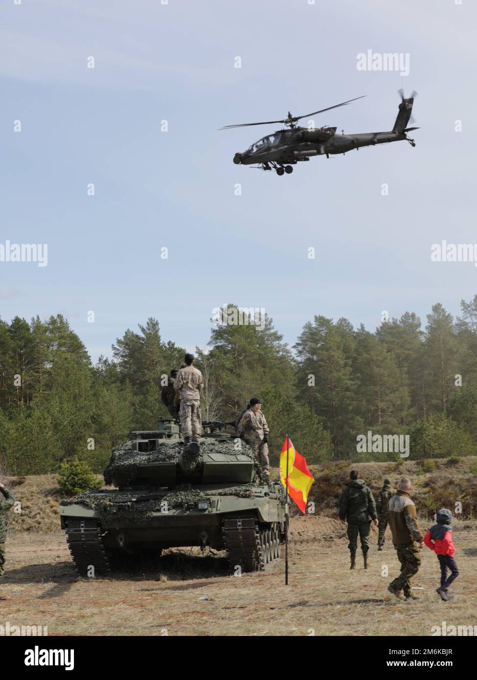 Soldiers from NATO enhanced forward presence (eFP) Latvia watch as ...