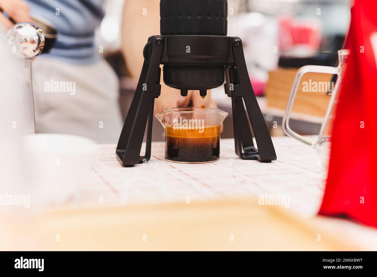 Barista making espresso coffee using Aeropress in cafe Stock Photo - Alamy