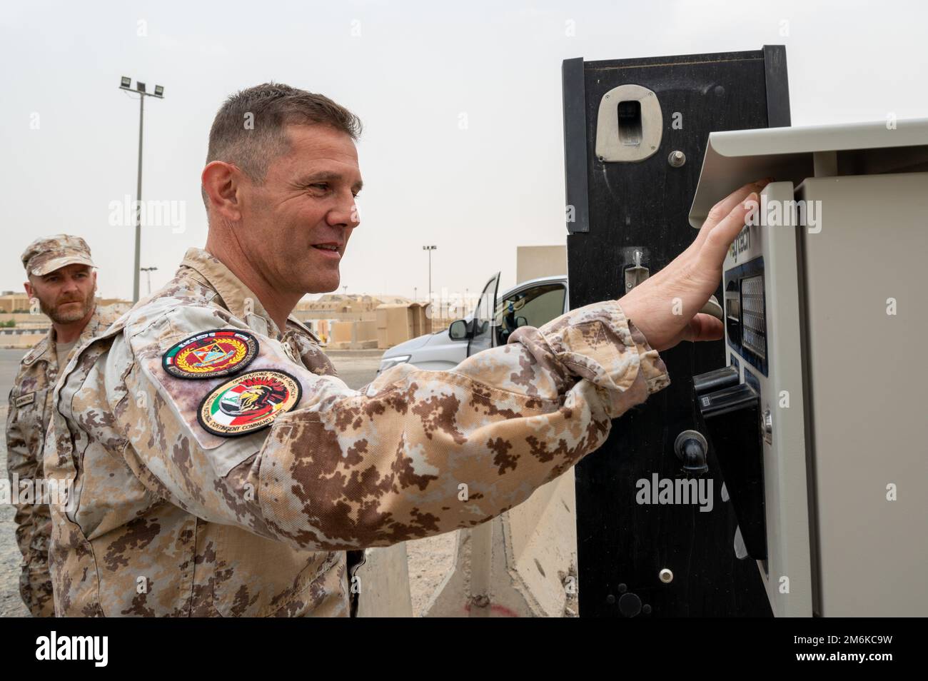 Italian Air Force Chief Sgt. Maj. Andrea Pala keys buttons on a new ...