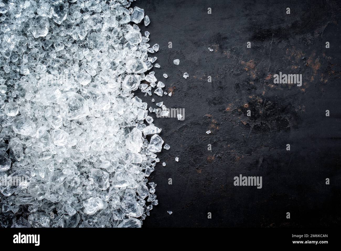 Artificial crashed ice offered as top view on old rustic metal sheet ...