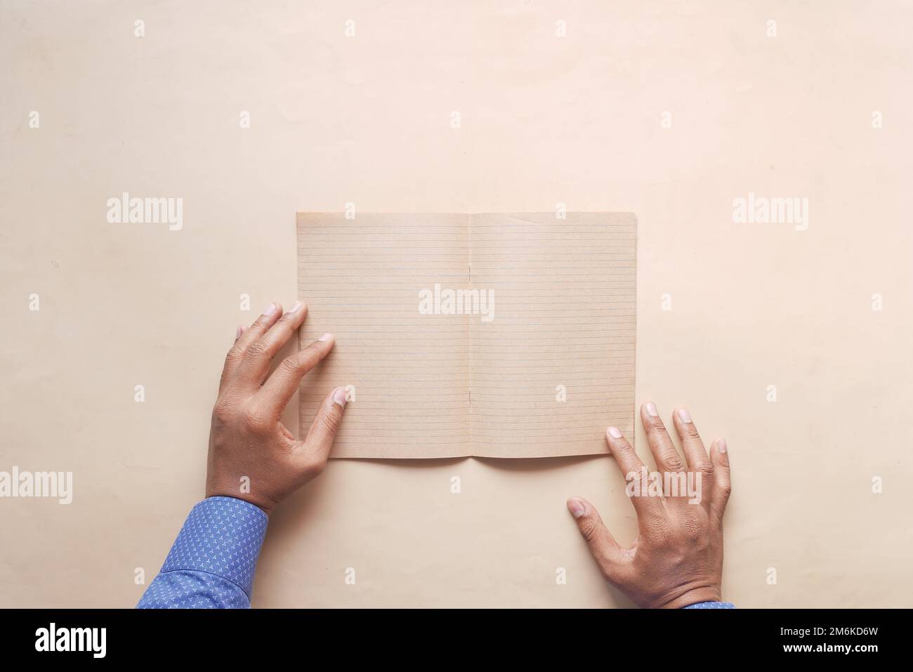 men hand turning a Old Paper texture Stock Photo - Alamy