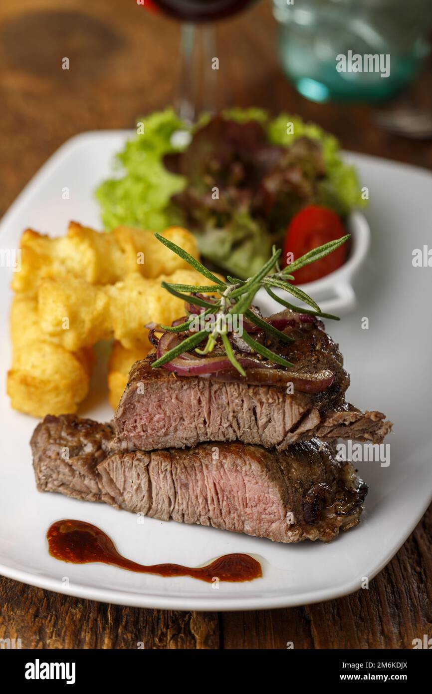 Steak slices on a plate Stock Photo - Alamy