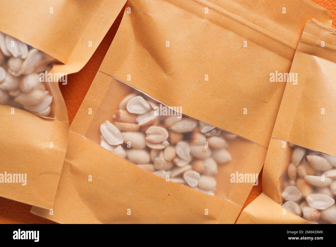peanuts in a paper packet close up Stock Photo - Alamy