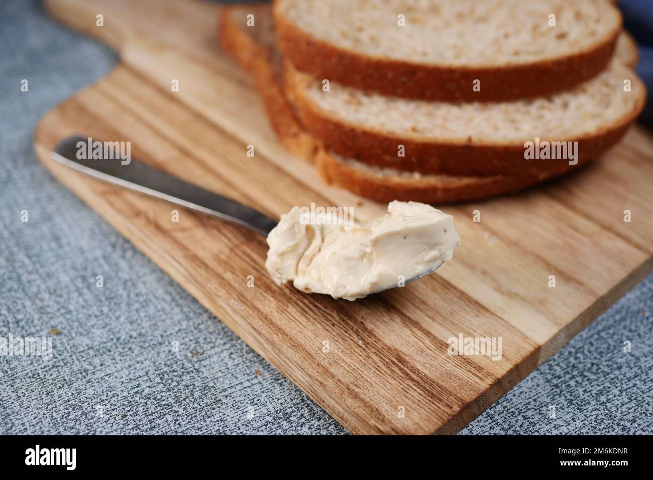low fact cheese cream spread on a bread Stock Photo - Alamy