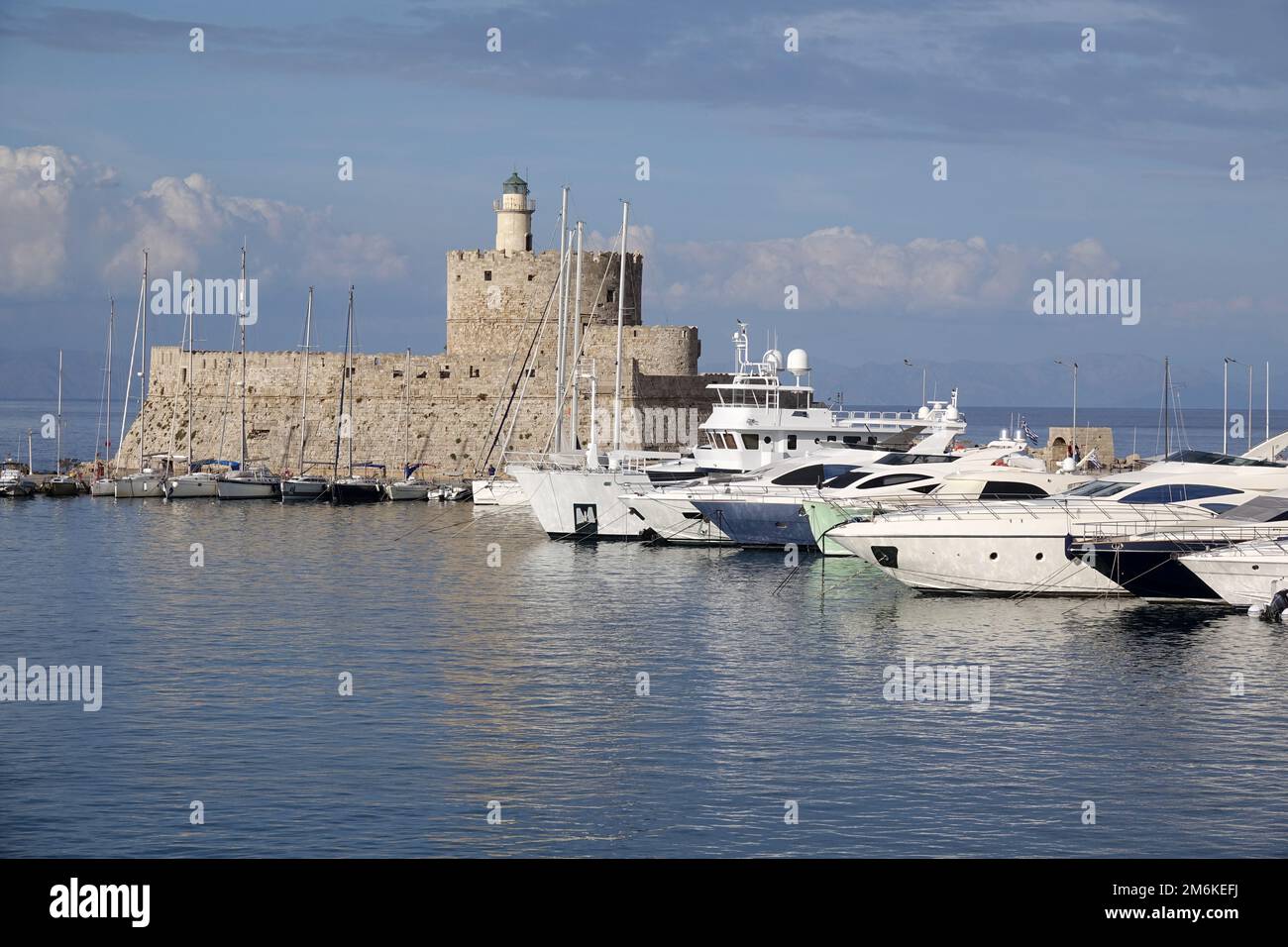 Lighthouse in Mandraki harbor in Rhodes town Stock Photo - Alamy