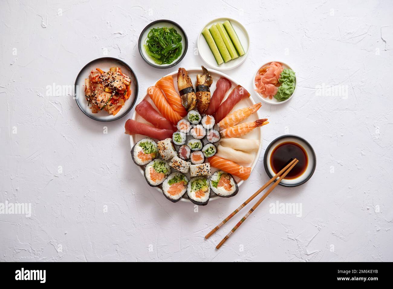 Various sushi rolls placed on round ceramic plate Stock Photo - Alamy