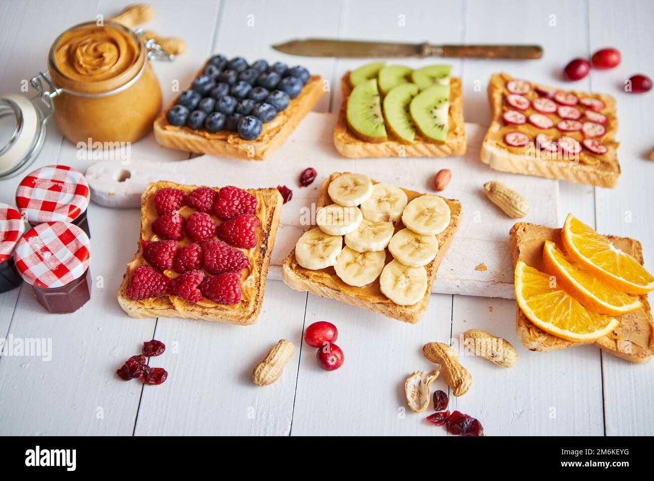 Sweet toast assortment with fresh fruit and berries on white Stock ...