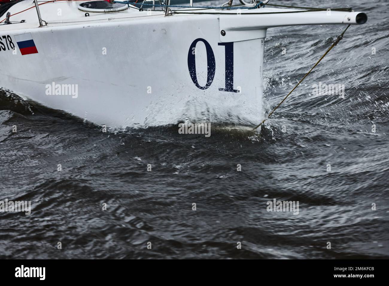 The bow of the boat cuts through the water, bowsprit of sailing yacht ...