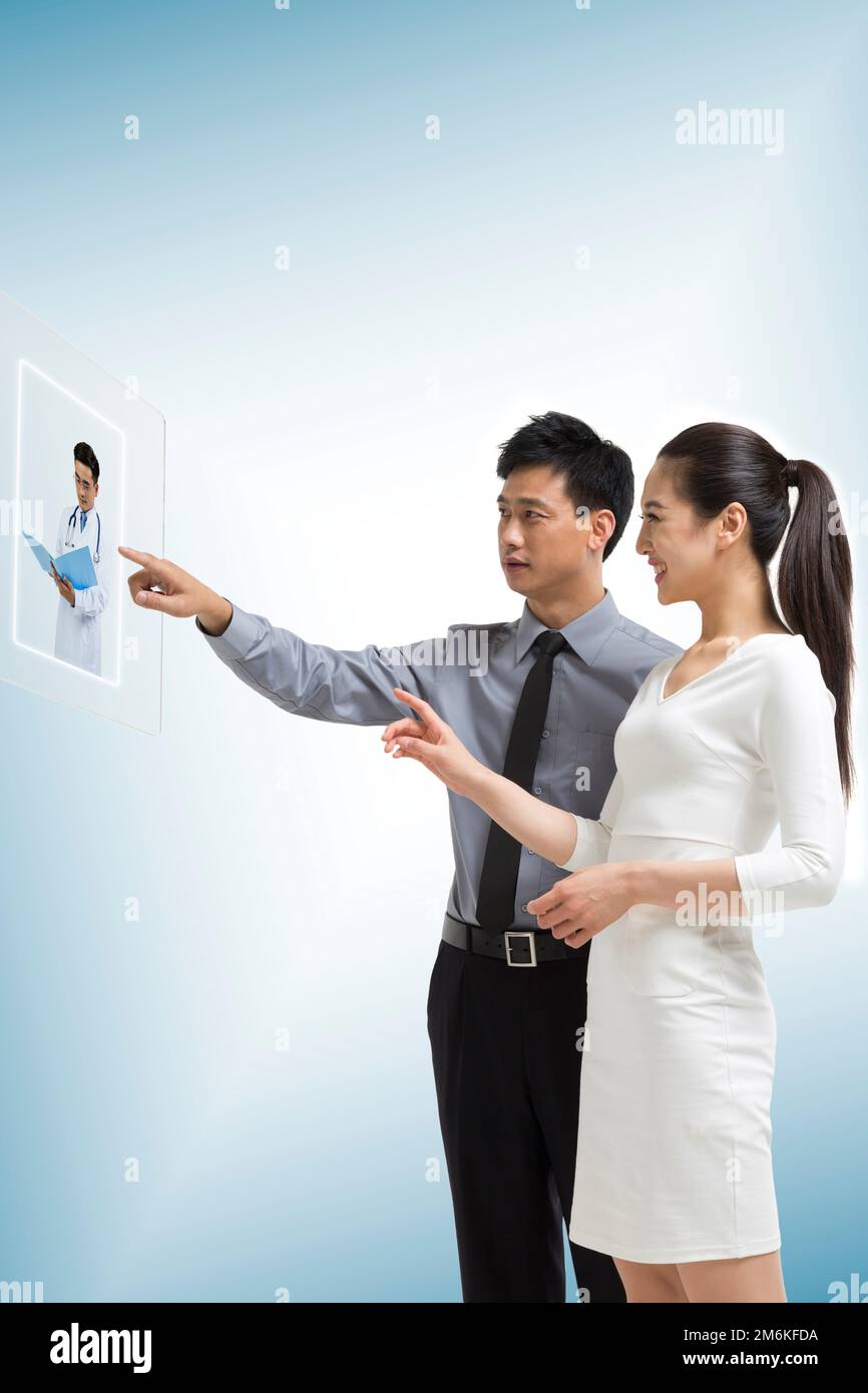 Business people use the touch screen technology Stock Photo - Alamy