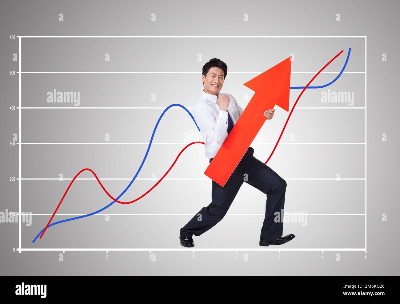 A young business man drawing curve chart Stock Photo - Alamy
