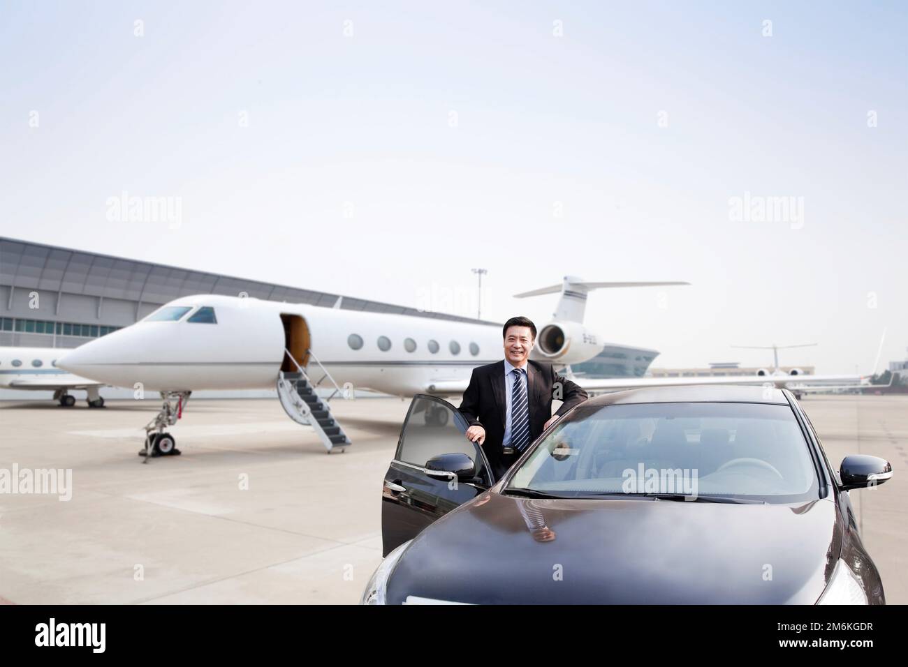 Business men arrived at the airport by car Stock Photo - Alamy