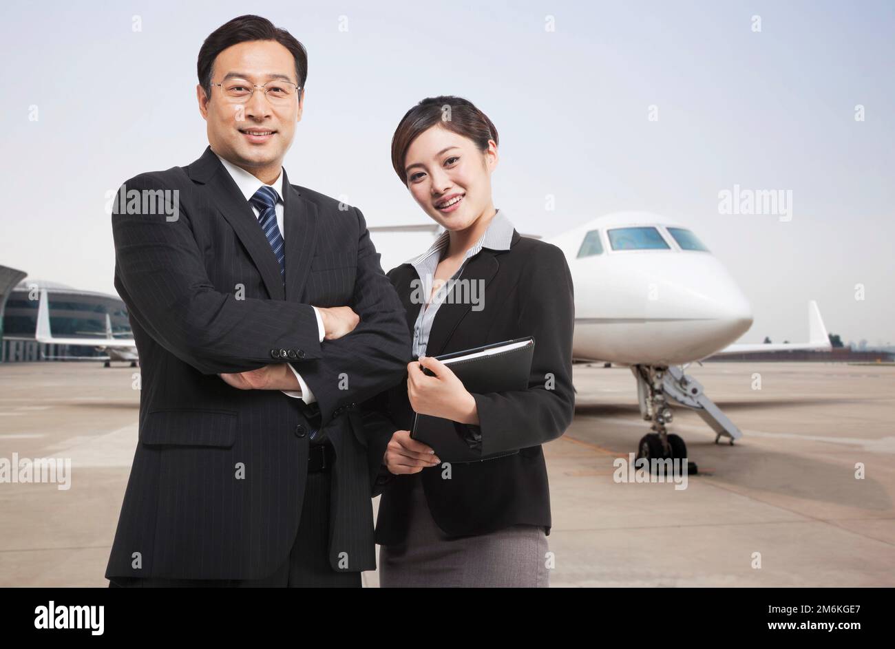 Business man and a private jet Stock Photo - Alamy