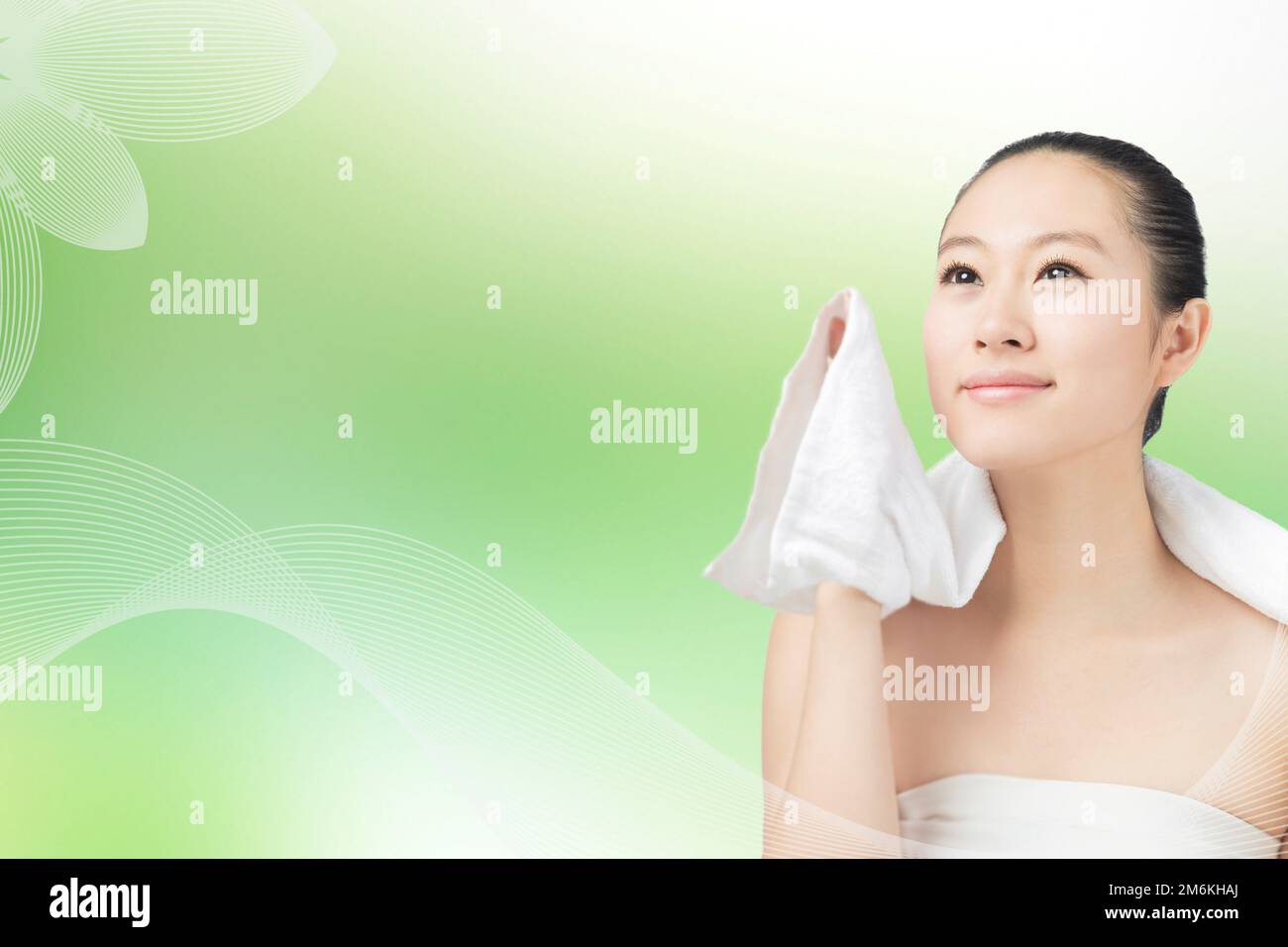Shed on young woman holding a white towel to wipe the sweat Stock Photo ...