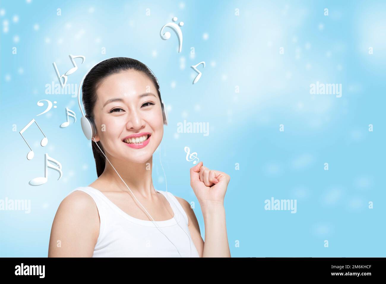 Shed happy young woman wearing headphones Stock Photo - Alamy