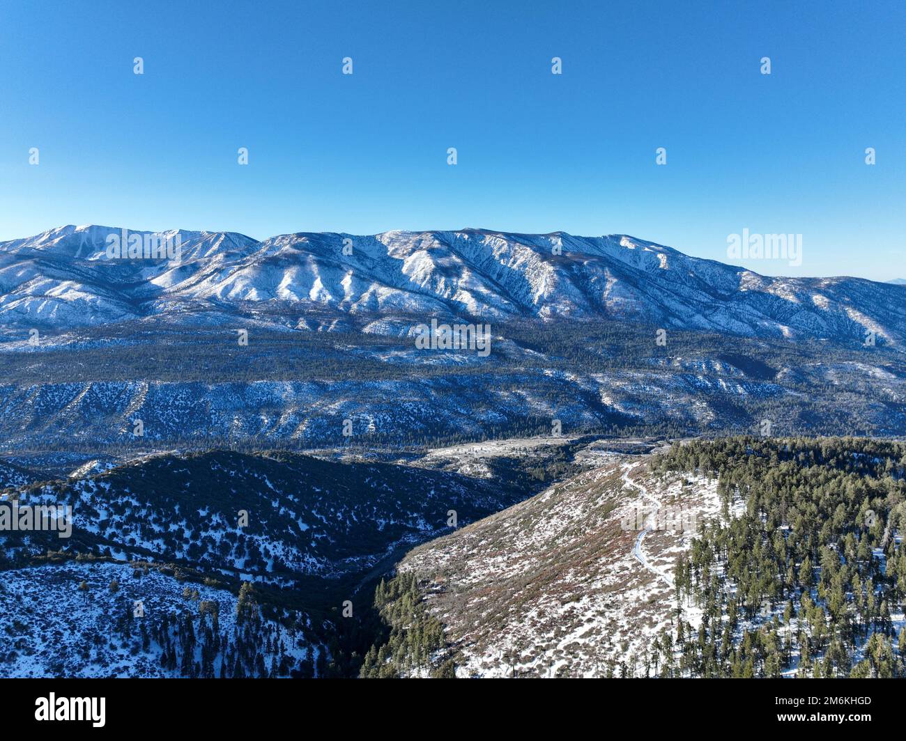 Aerial view over Big Bear Valey and Lake with now, South California ...