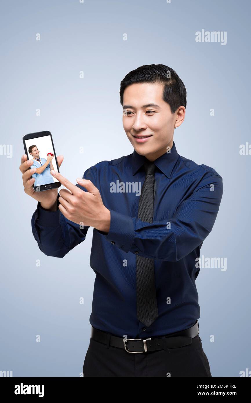 Business men to use smart phone Stock Photo - Alamy