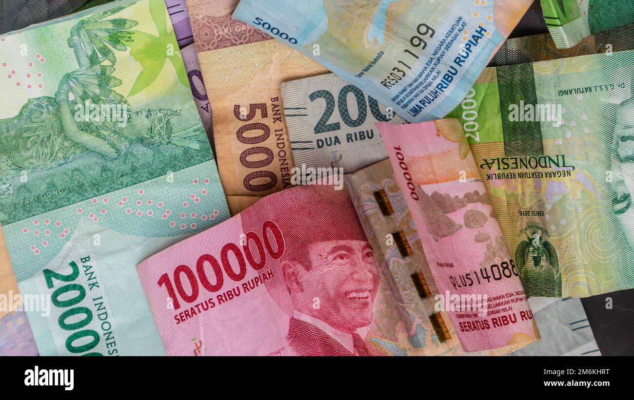 pile of rupiah banknotes as background Stock Photo - Alamy