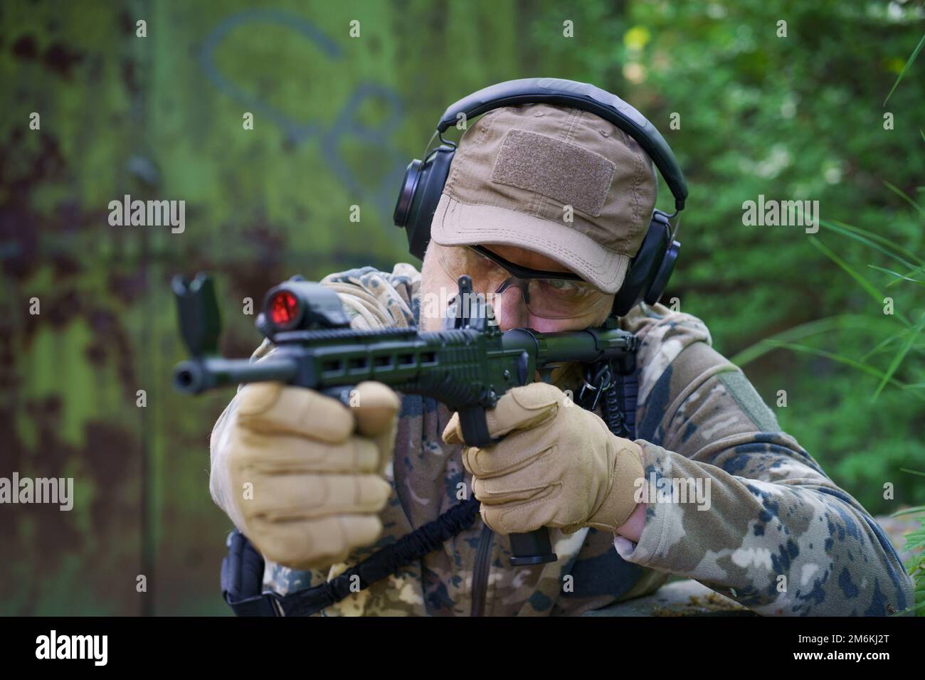 Civil police man in tactical training course. Shooter with a gun in ...