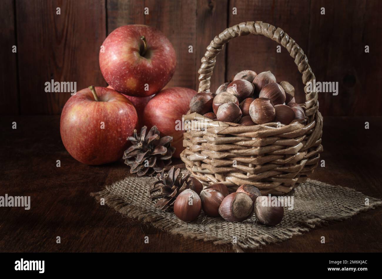 Nuts and other fruits on a dark wooden background Stock Photo - Alamy