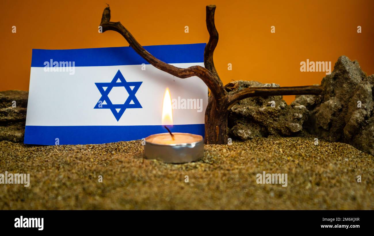 Israeli flag and burning candles in front of it, Holocaust memory day ...