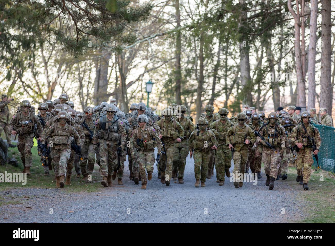 Cadets complete a ruck march to their next obstacle of Sandhurst 2022 ...