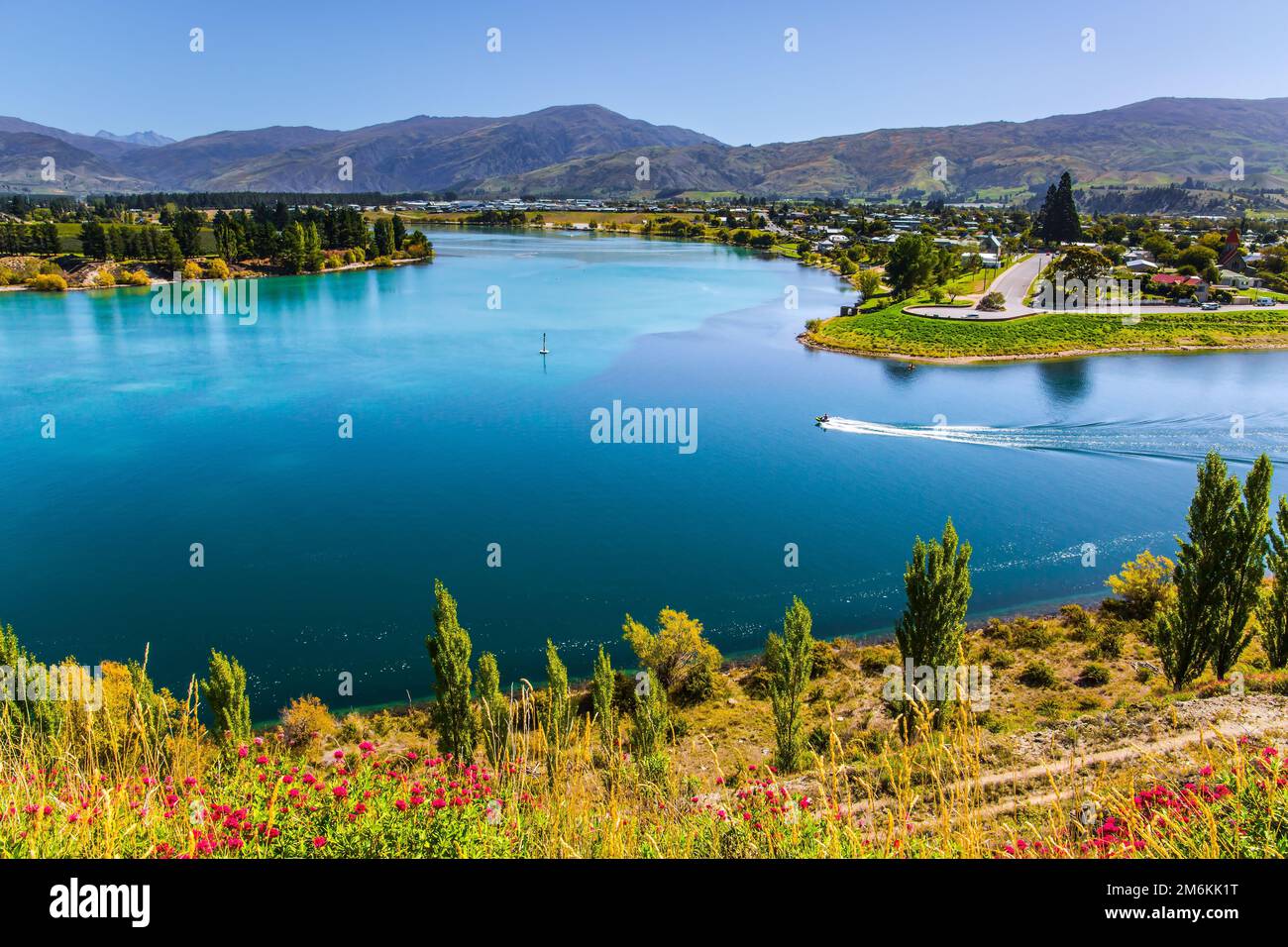 Motor boat floats on the lake Stock Photo - Alamy