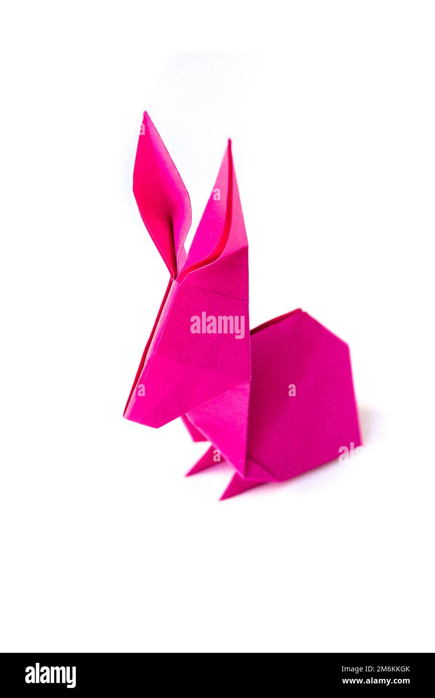 Pink paper rabbit origami isolated on a white background Stock Photo ...