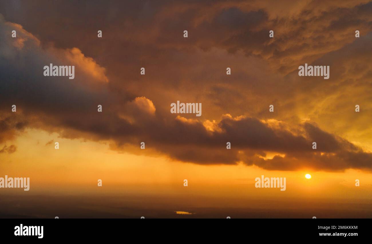 A wonderful bright dawn, above the clouds. Drone flight over the dawn ...