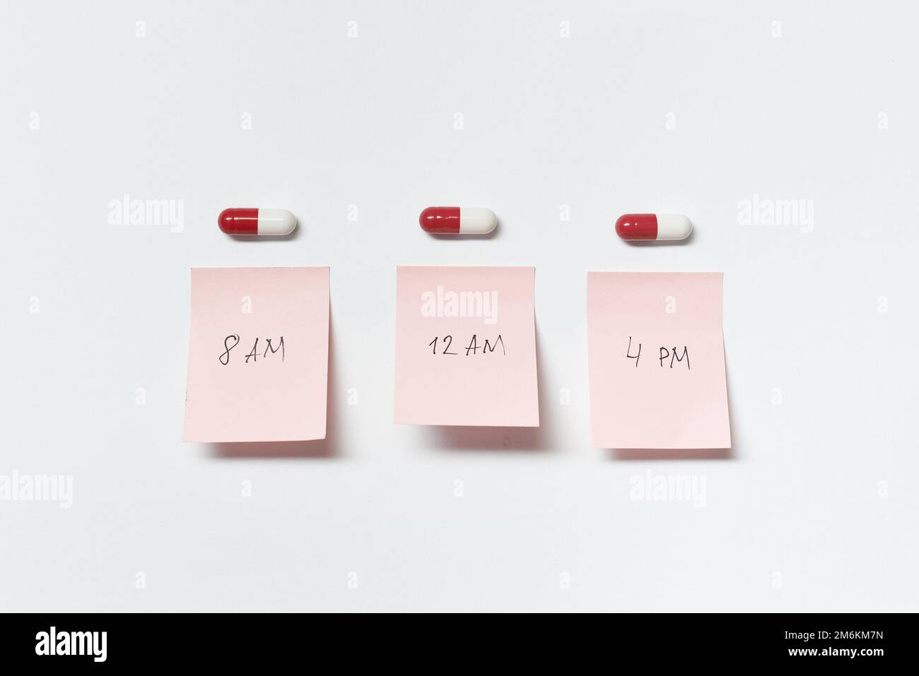 Pharmaceutical pills and medication time notes Stock Photo - Alamy