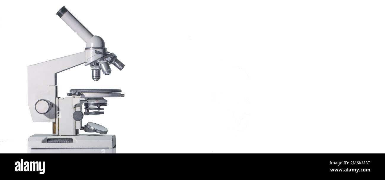A microscope with three lenses on a white background. Concept, research ...