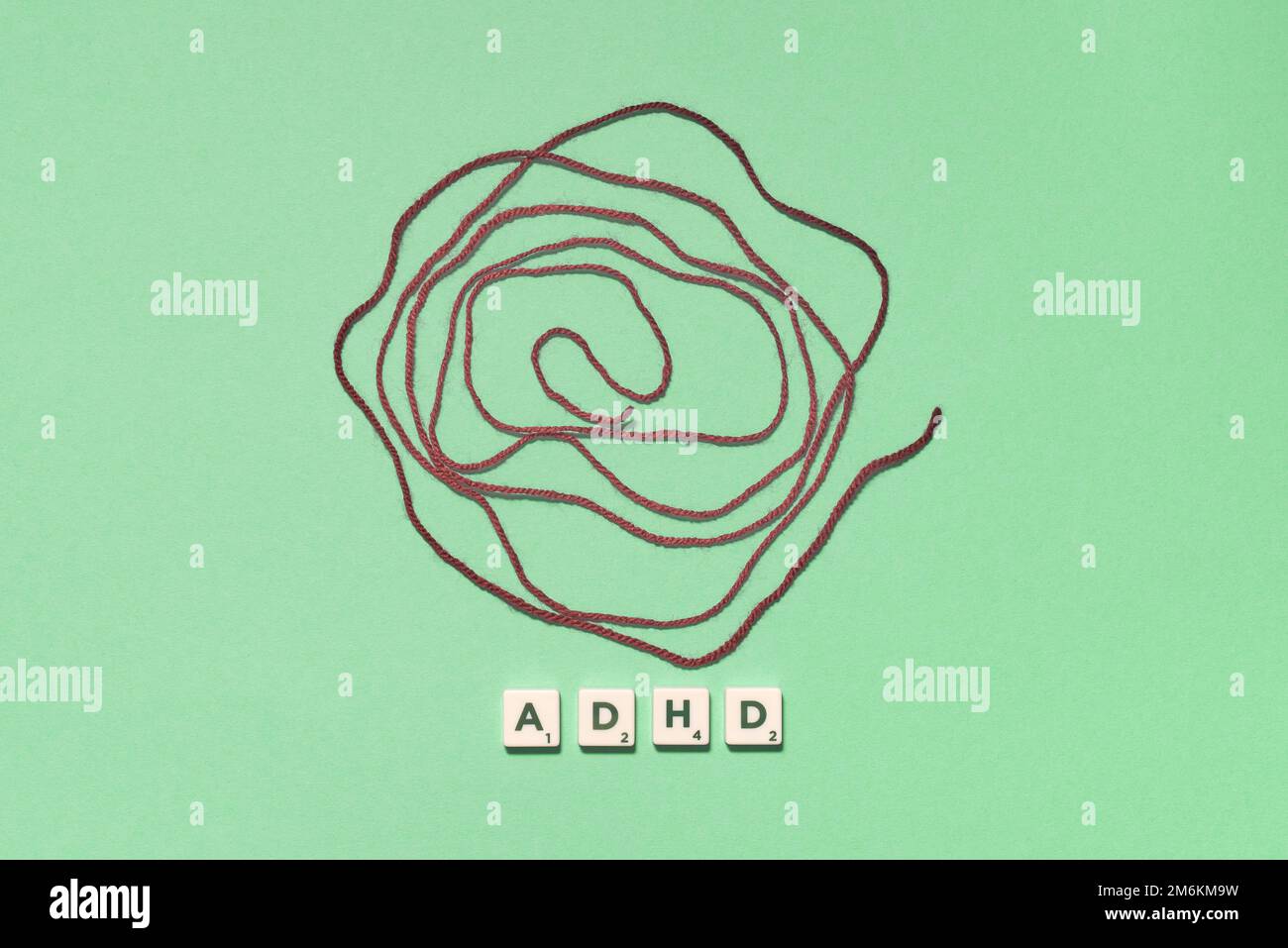 ADHD formed of scrabble blocks with tangled thread Stock Photo - Alamy