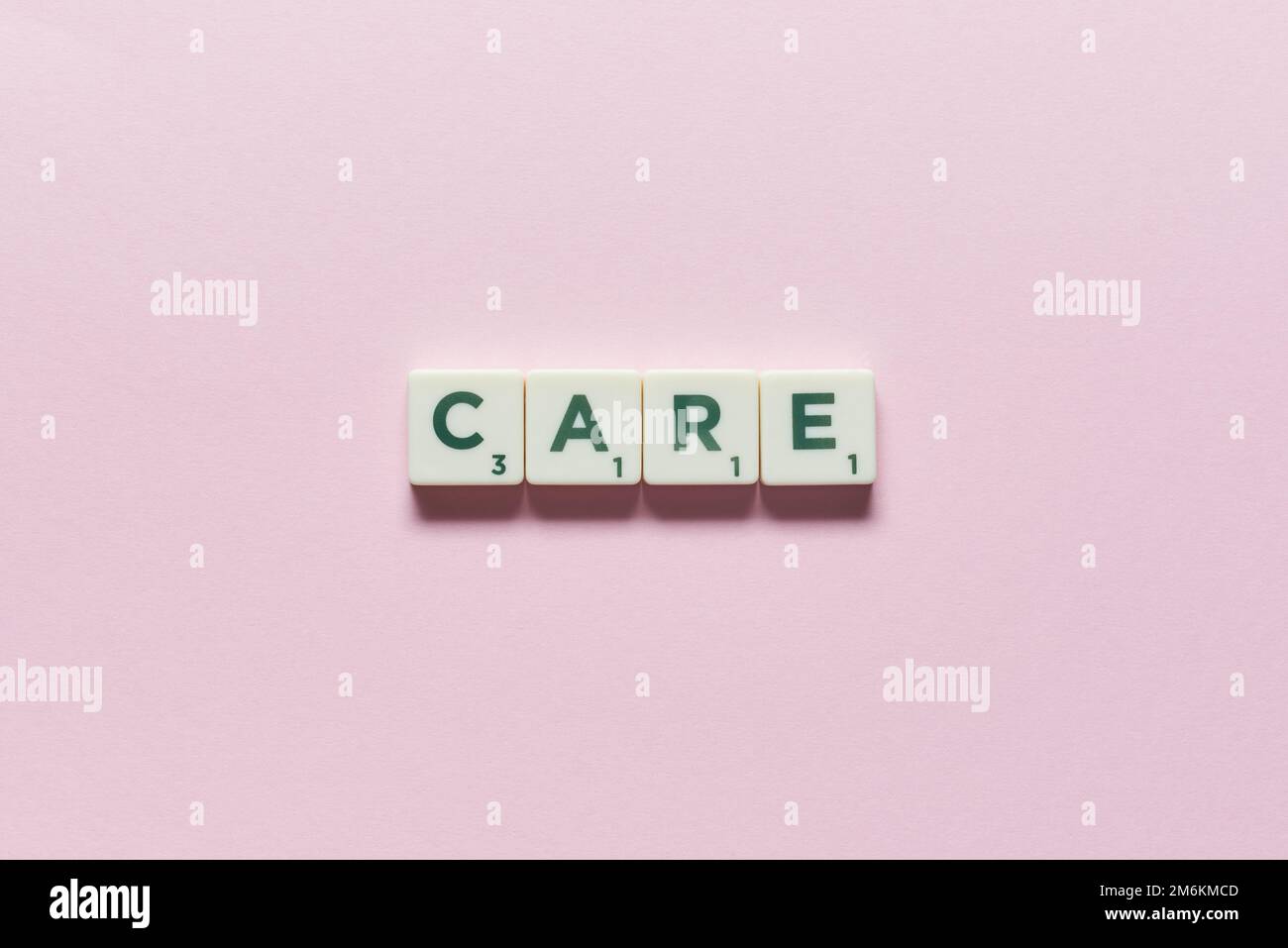 Care formed of scrabble blocks Stock Photo - Alamy