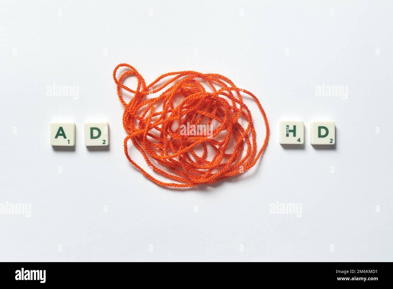 ADHD formed of scrabble blocks with tangled thread Stock Photo - Alamy
