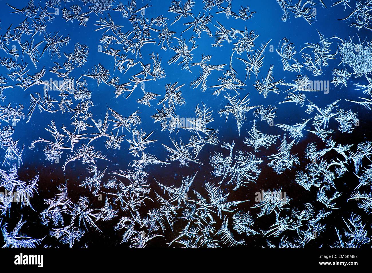 Frost on the glass. Abstract natural texture. Drawing of ice crystals ...