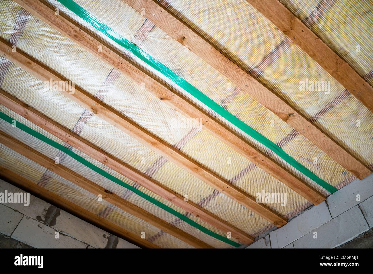 Insulated ceiling of a private house with a wooden crate. The roof is ...