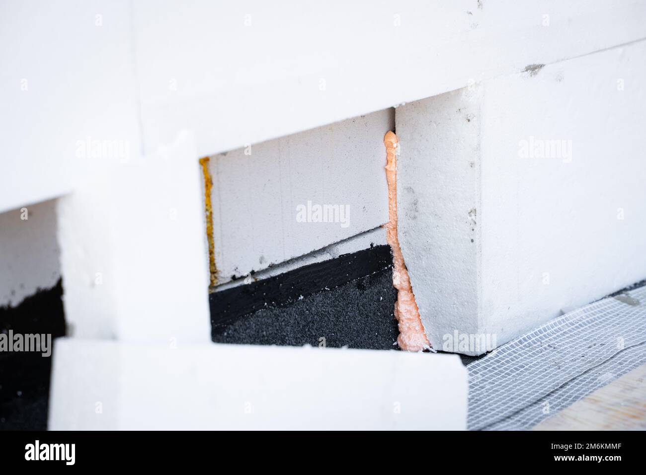 The process of insulating a house with polystyrene foam insulation. A ...